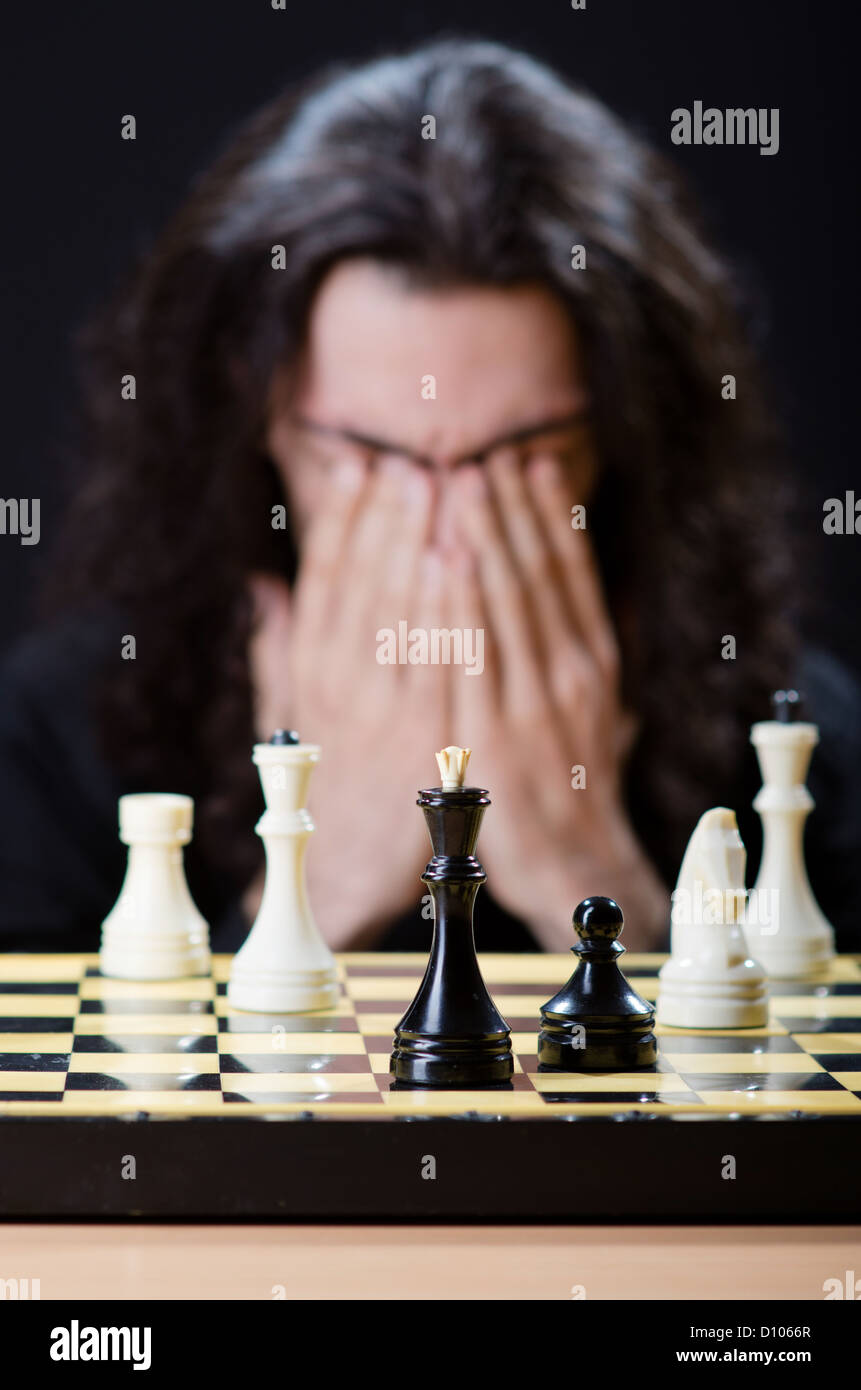 Chess player playing his game Stock Photo - Alamy