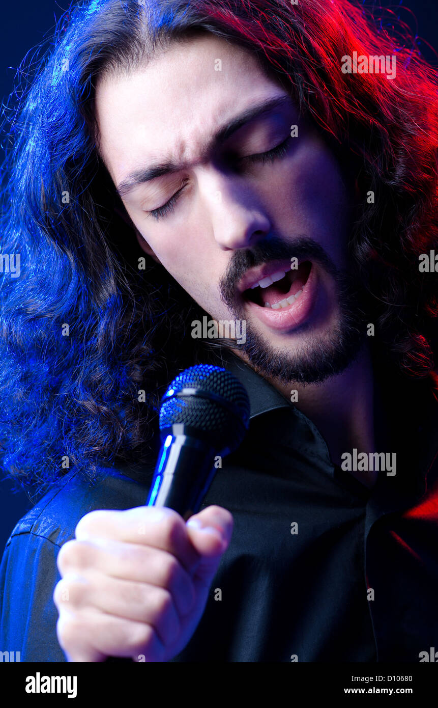 Man singing at the concert Stock Photo - Alamy