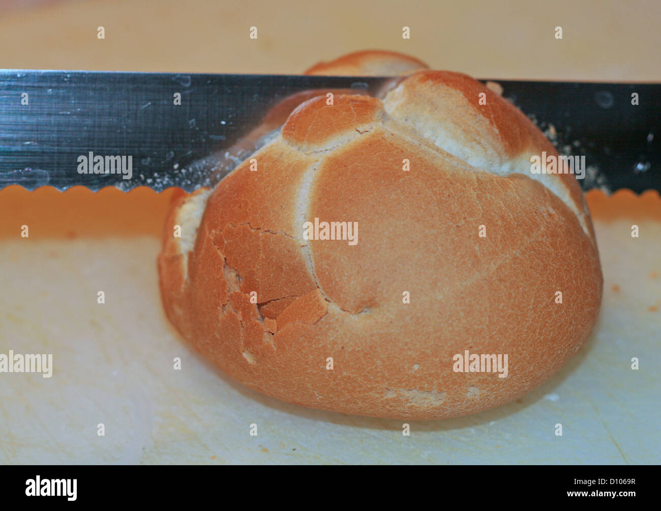 piece of bread cut with a knife by the blade very sharp Stock Photo - Alamy