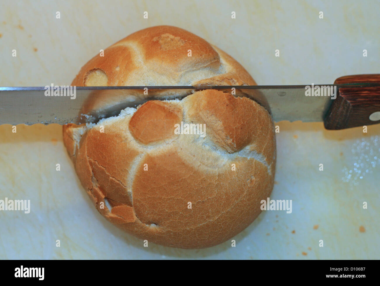 piece of bread cut with a knife by the blade very sharp Stock Photo - Alamy