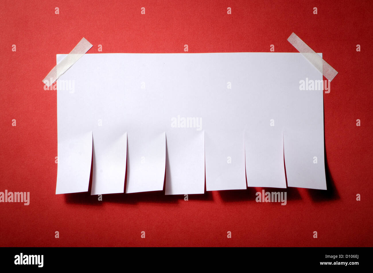 Tear off paper notice on the wall Stock Photo - Alamy