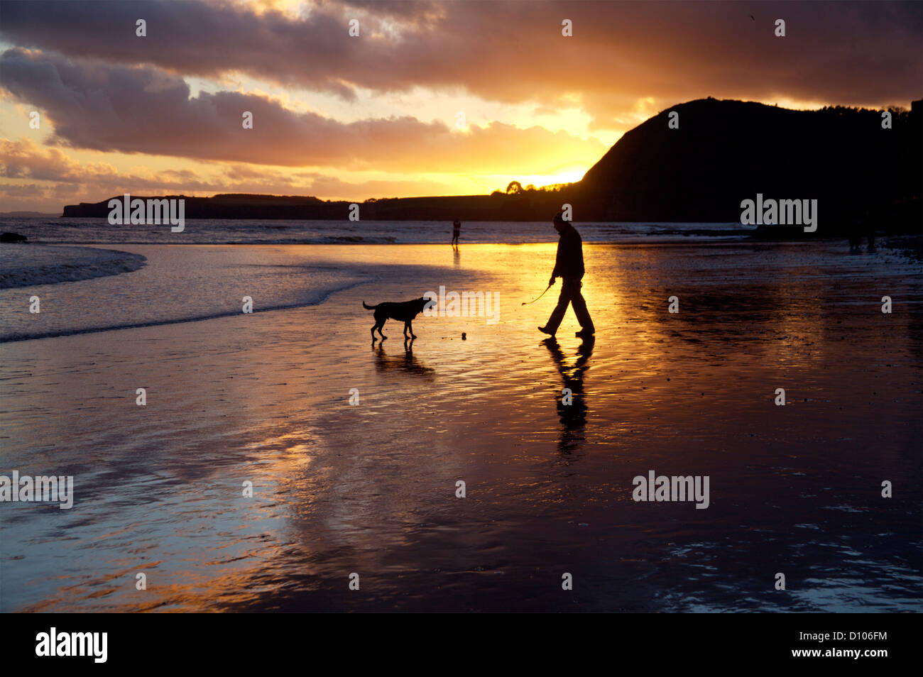 Sidmouth beach sunset and silhouettes, Devon, England Stock Photo - Alamy