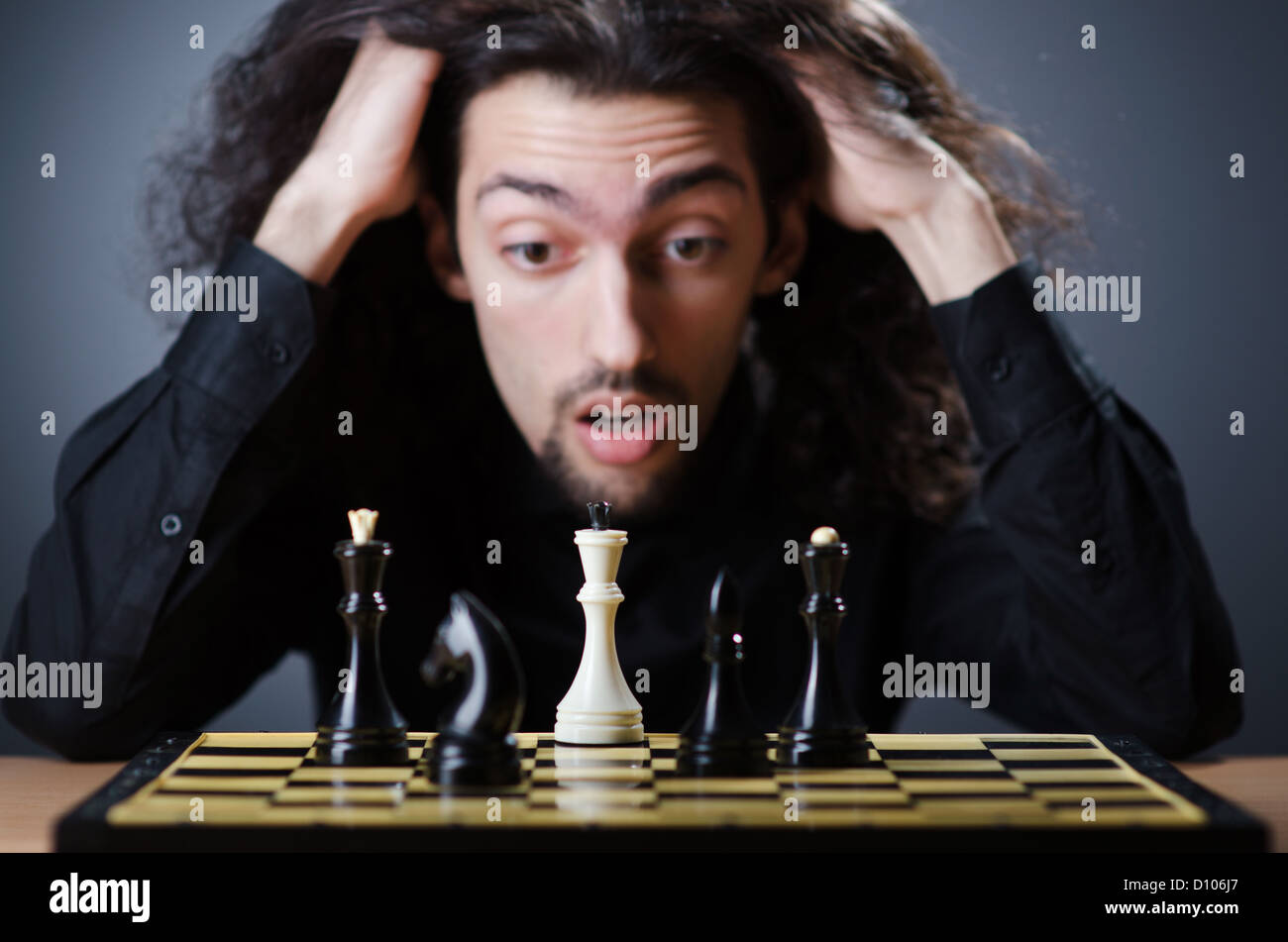 Chess player playing his game Stock Photo - Alamy
