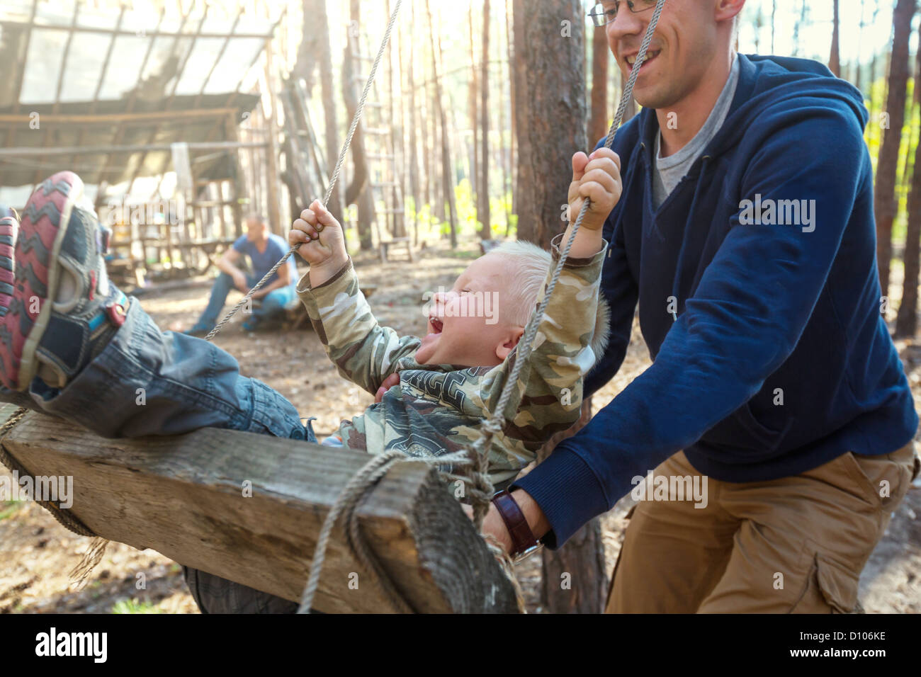 Beautiful boy swinging on swing hi-res stock photography and images - Alamy