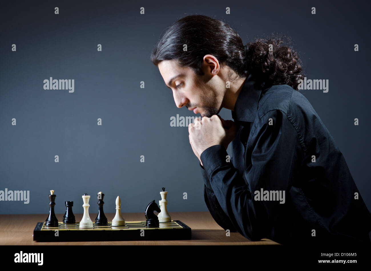 Chess player playing his game Stock Photo - Alamy