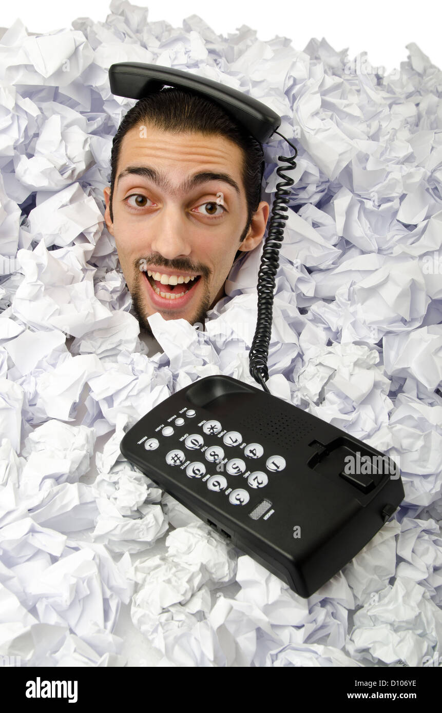 Man with lots of crumpled paper Stock Photo - Alamy