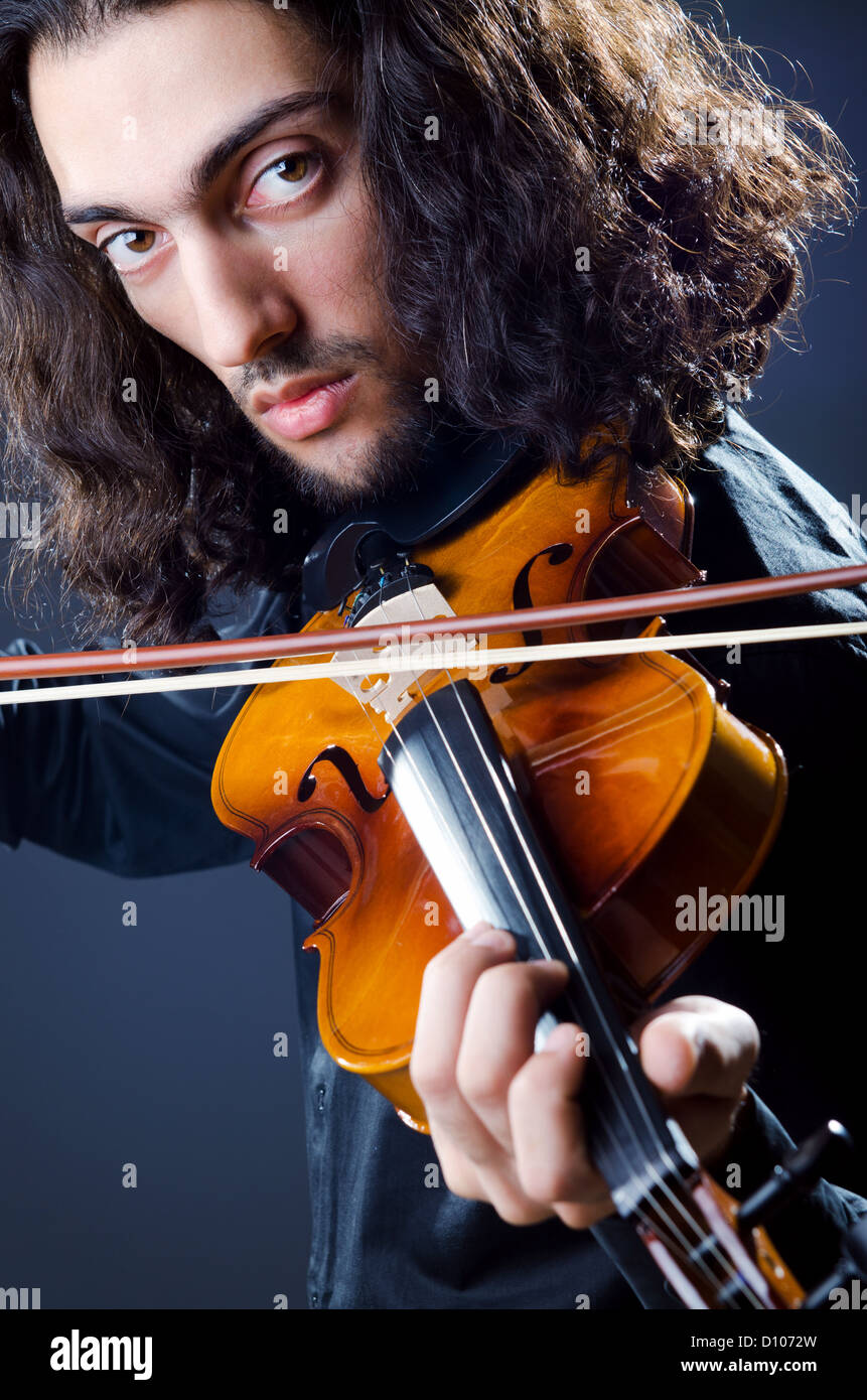 Young violin player playing Stock Photo - Alamy
