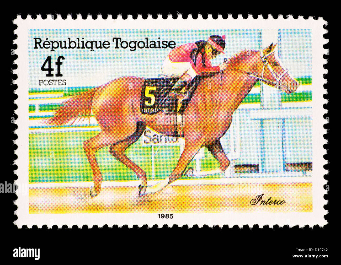 Postage stamp from Togo depicting a jockey on a racehorse Stock Photo ...