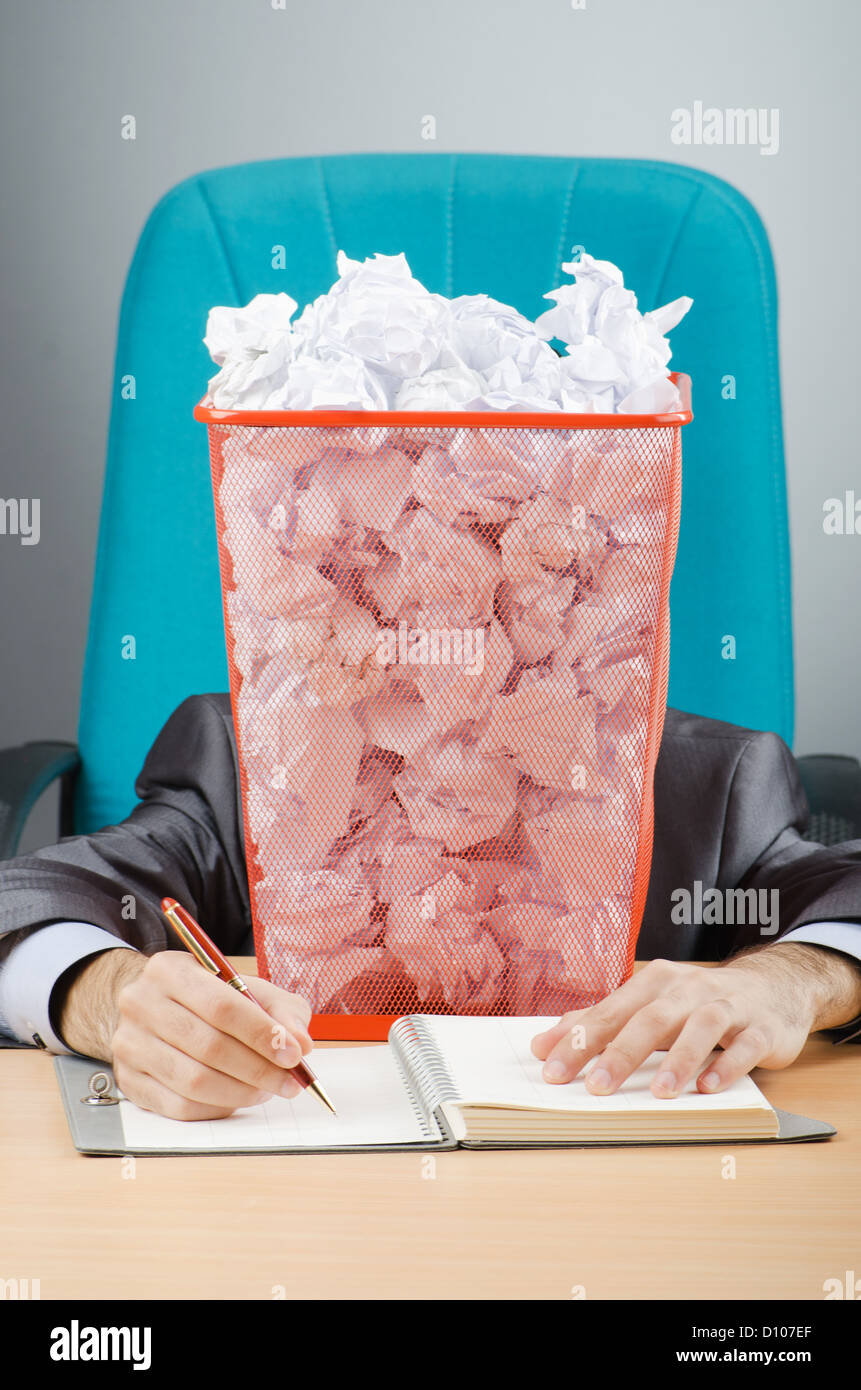 Man with lots of wasted paper Stock Photo - Alamy