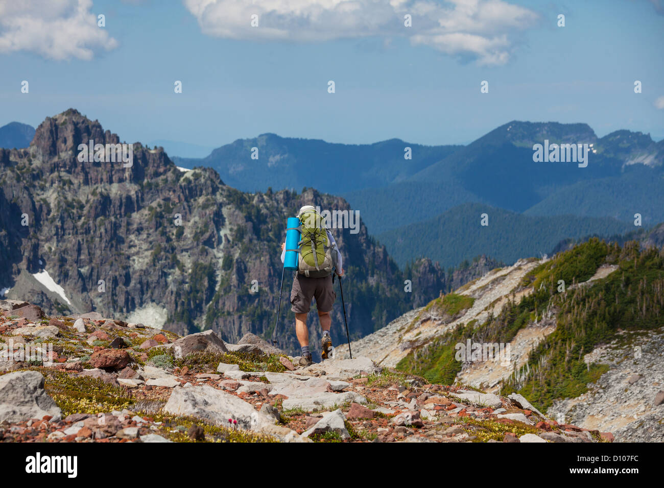 Hiker in mountains Stock Photo - Alamy