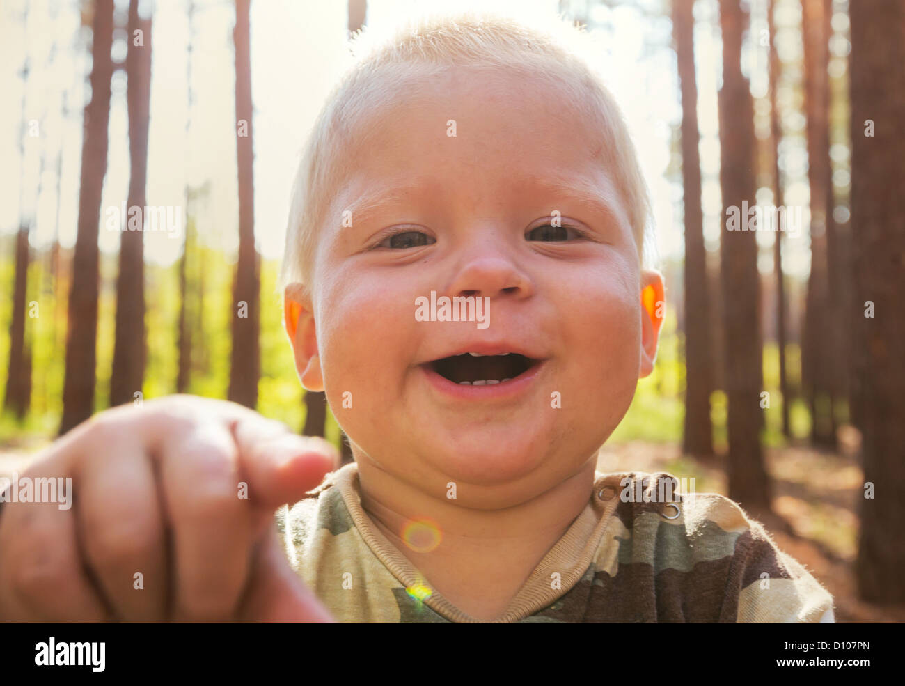 Young boy playing in park Stock Photo - Alamy
