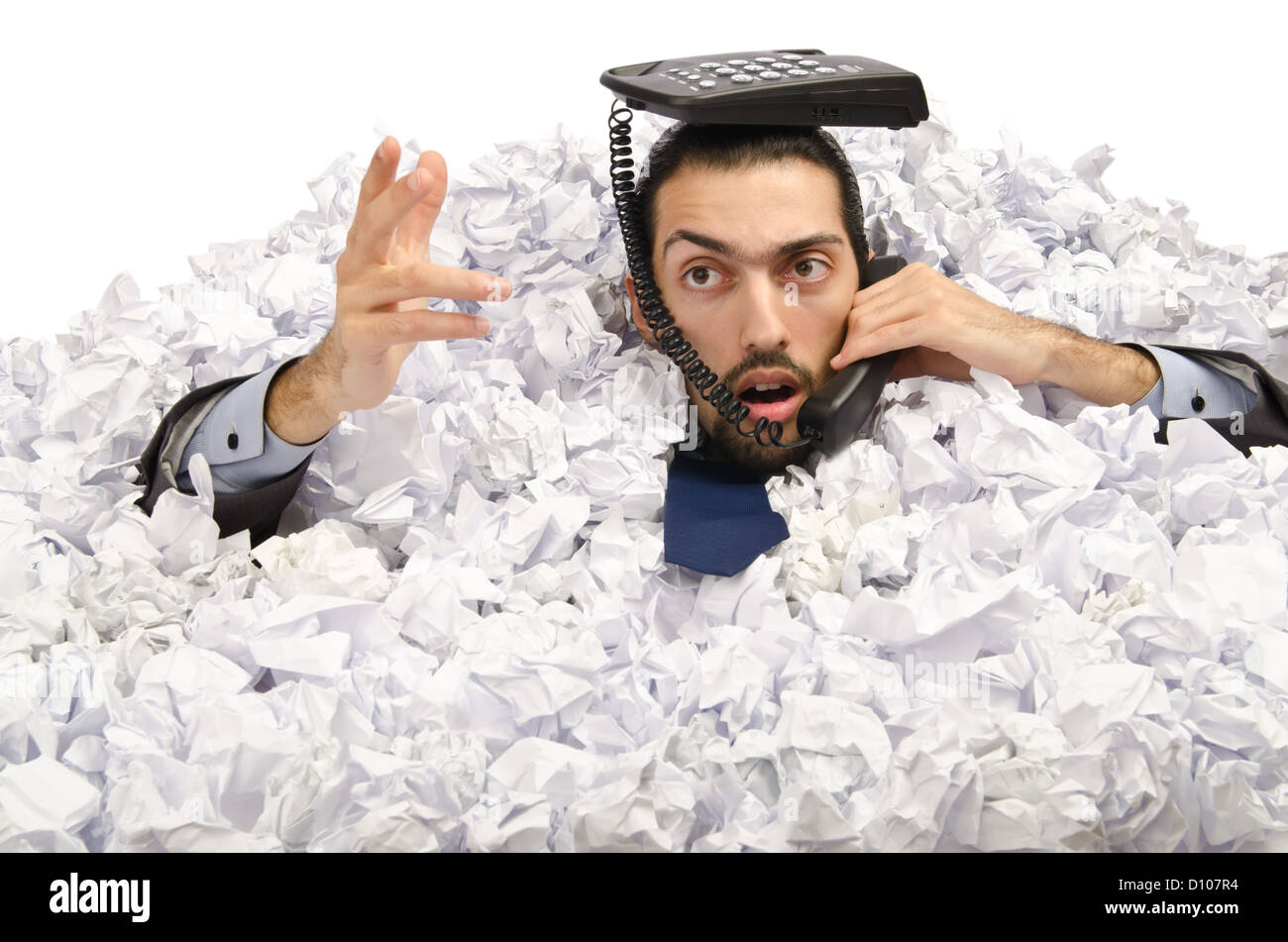 Man with lots of crumpled paper Stock Photo - Alamy