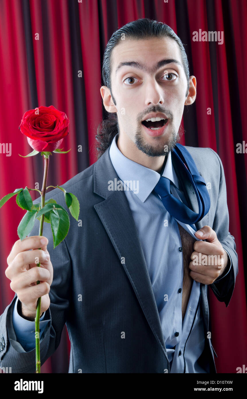 Young man with red rose Stock Photo - Alamy