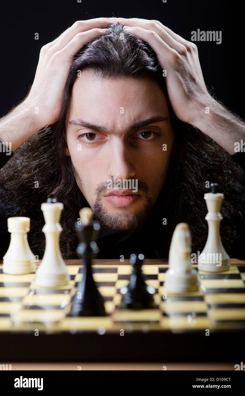 Chess player playing his game Stock Photo - Alamy