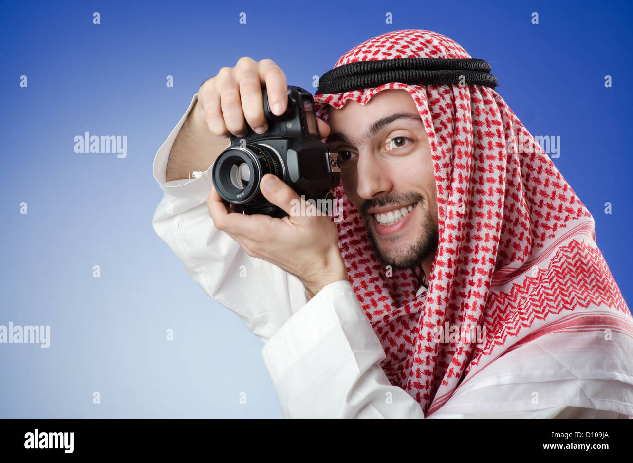 Arab photographer in studio shooting Stock Photo - Alamy