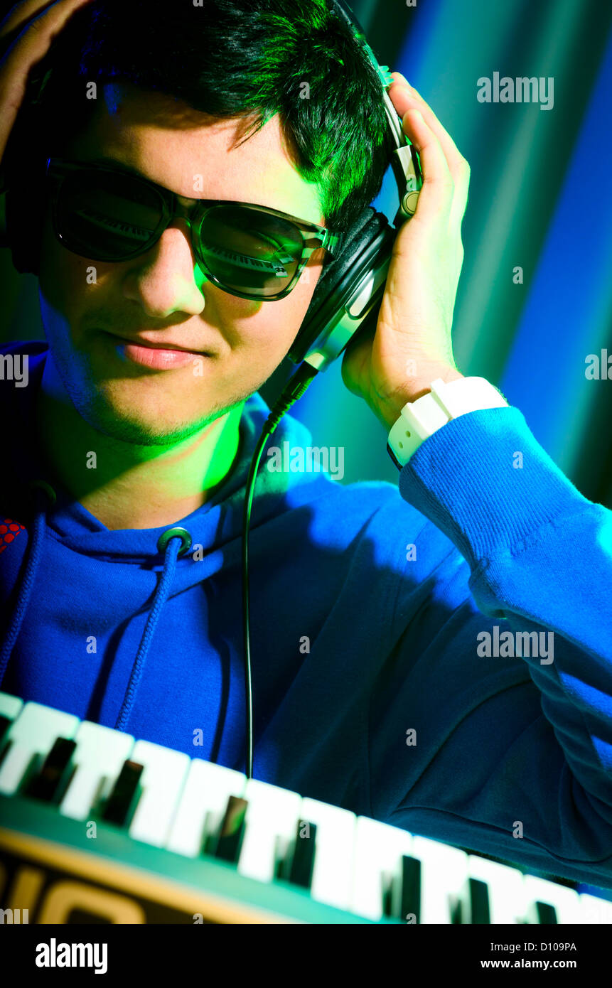 DJ mixing music at disco Stock Photo - Alamy