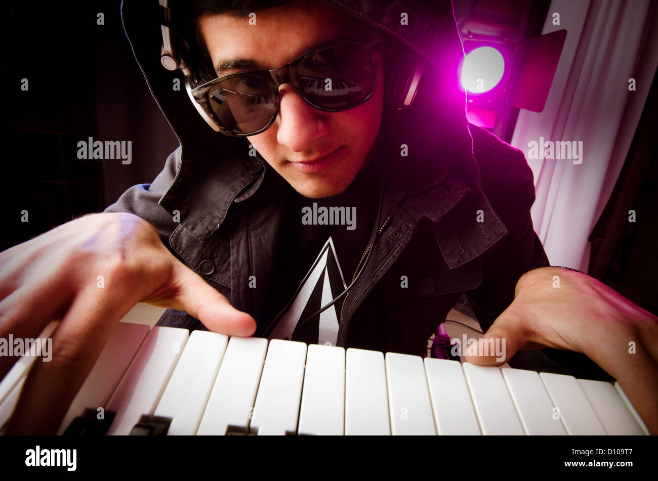 DJ mixing music at disco Stock Photo - Alamy