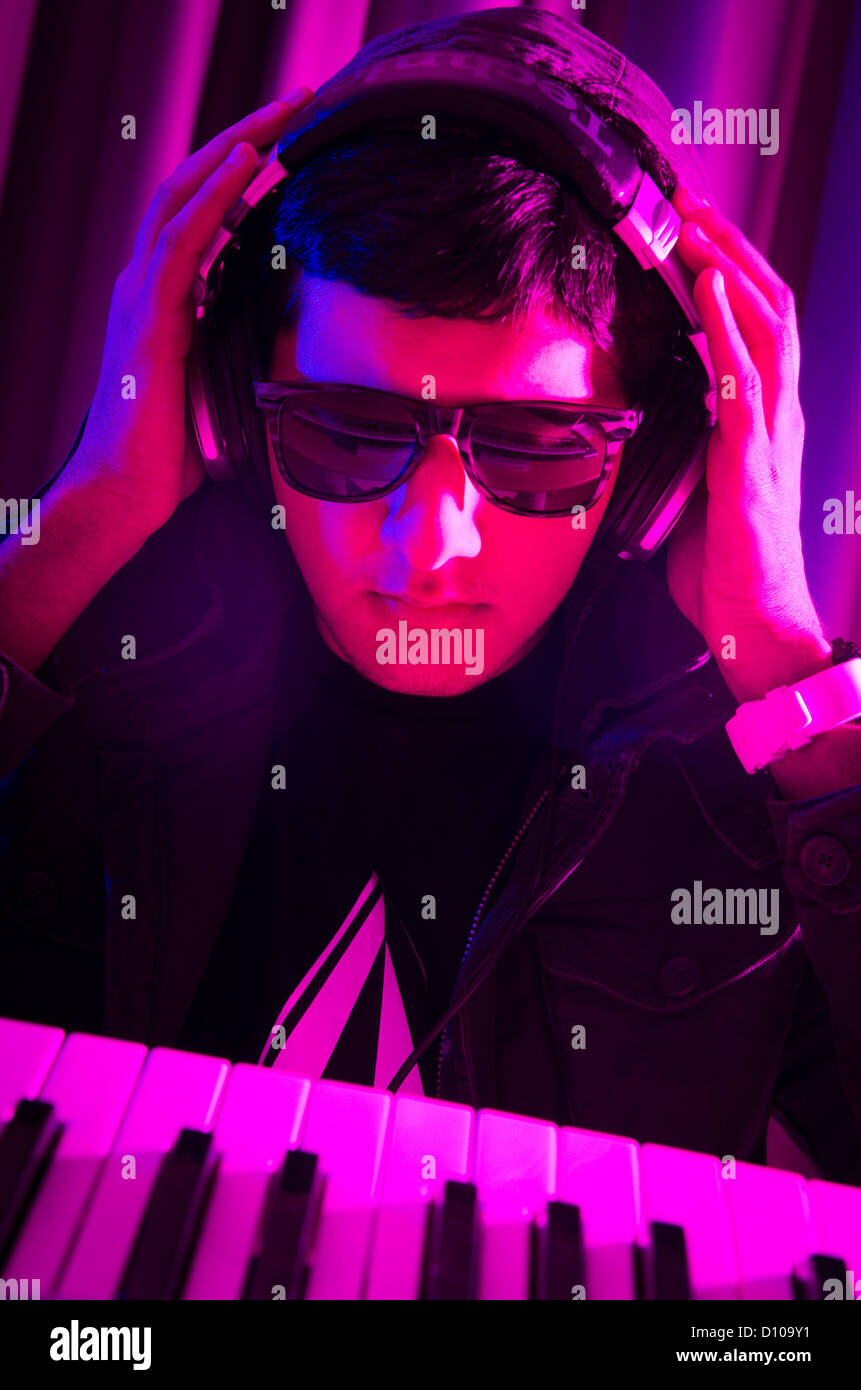DJ mixing music at disco Stock Photo - Alamy