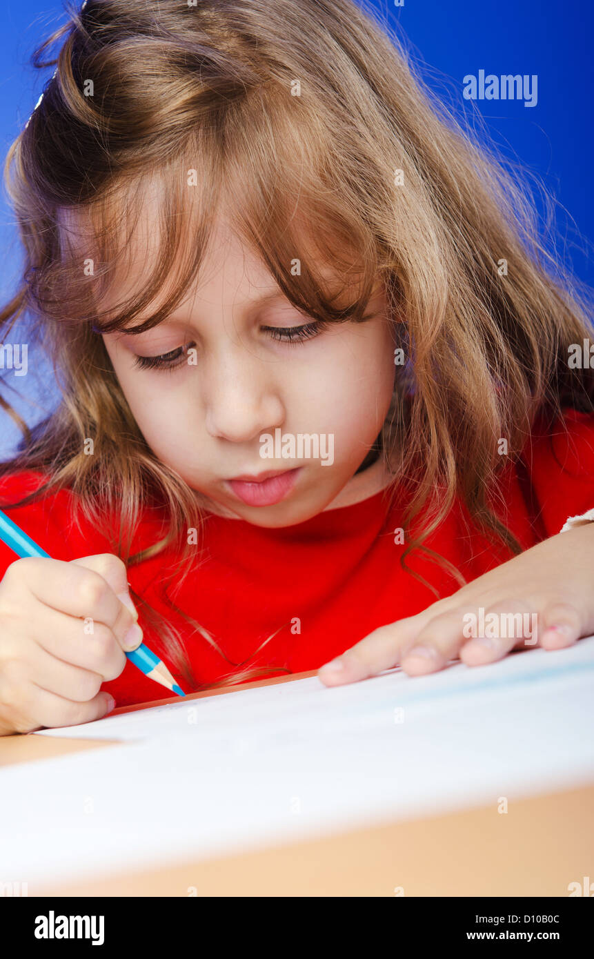 Little girl drawing with pencils Stock Photo - Alamy