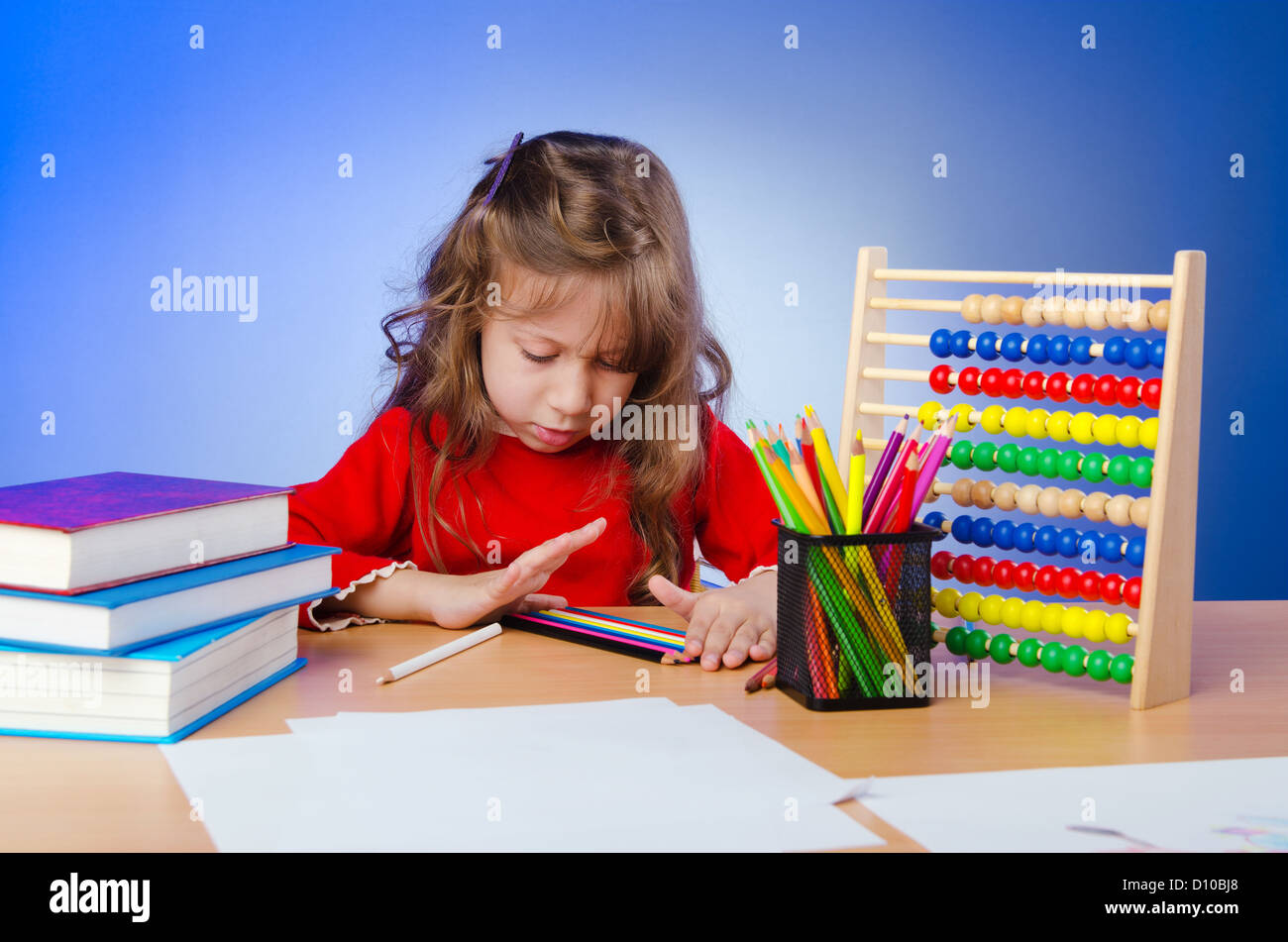 Little girl drawing with pencils Stock Photo - Alamy