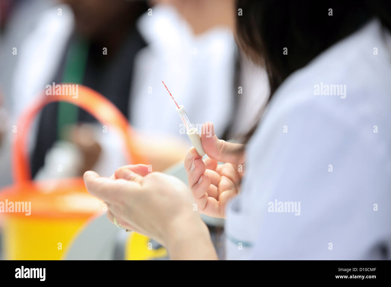 Close-up hands white laboratory coats students taking blood for test ...