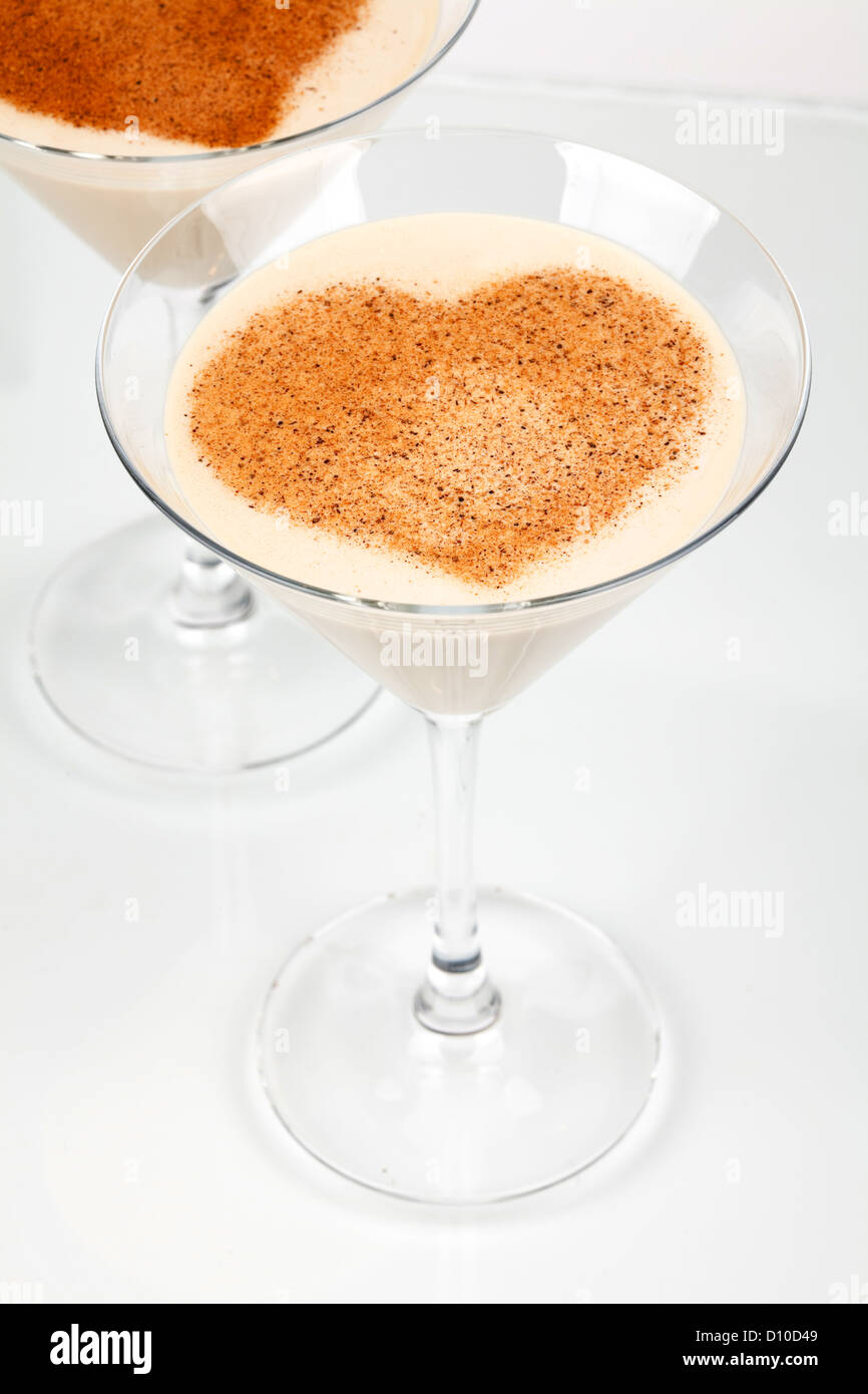 Milk alcohol cocktail with heart decoration isolated on white ...