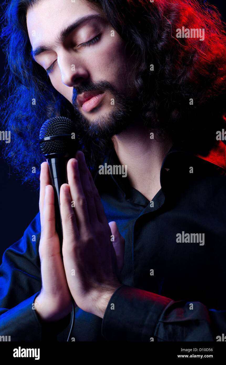 Man singing at the concert Stock Photo - Alamy