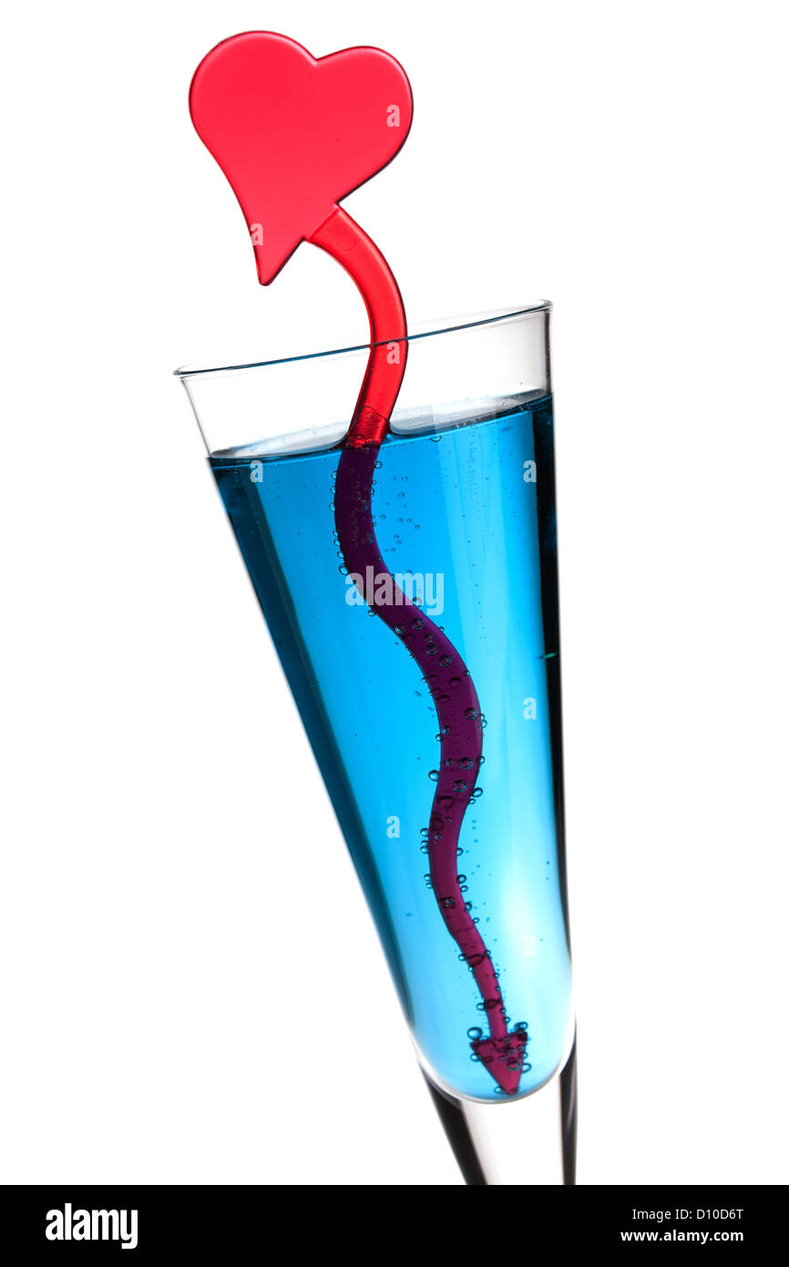Blue champagne alcohol cocktail with red heart decoration. Isolated on ...