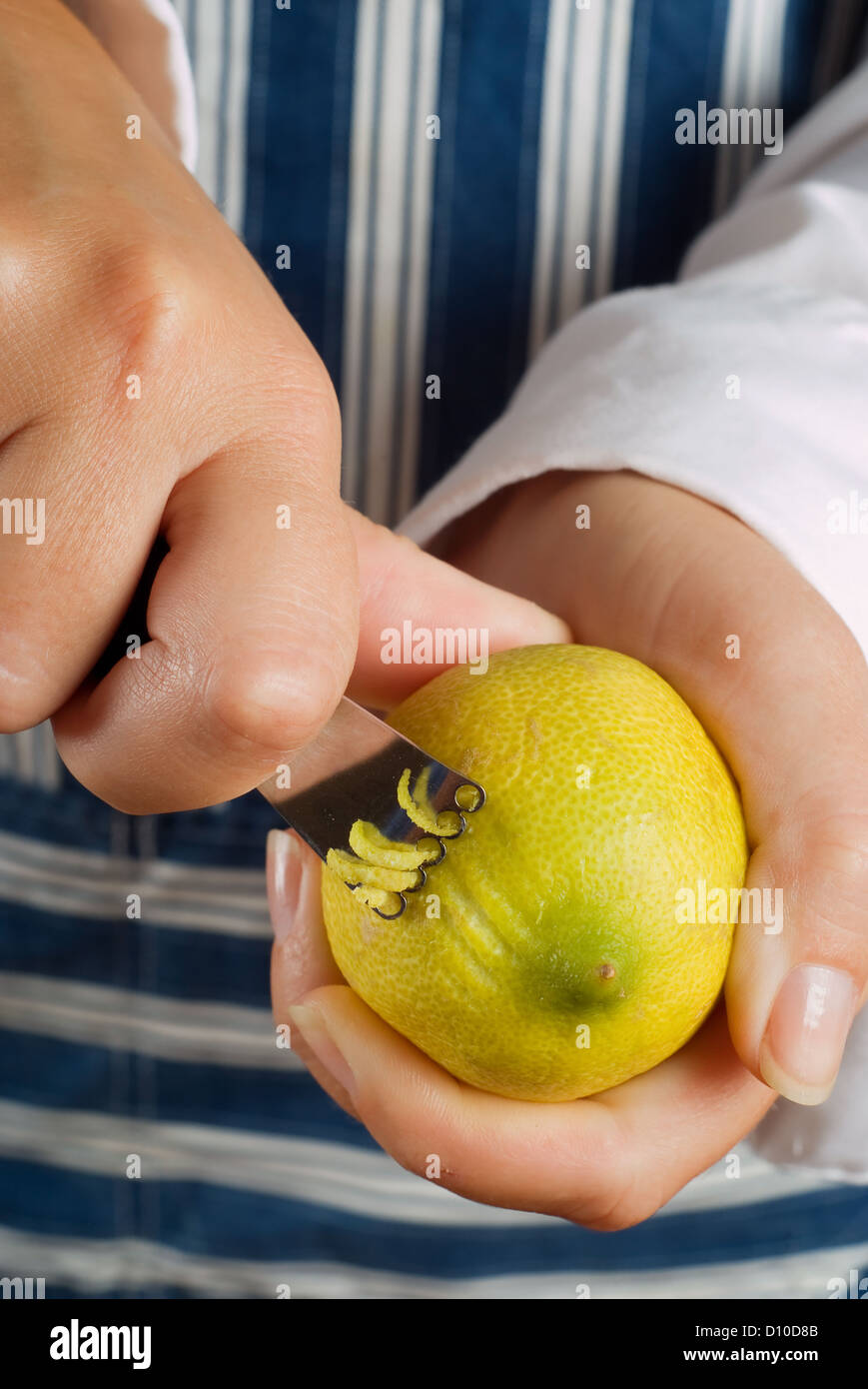 Female woman cook or chef cutting or zesting a lemon Stock Photo - Alamy