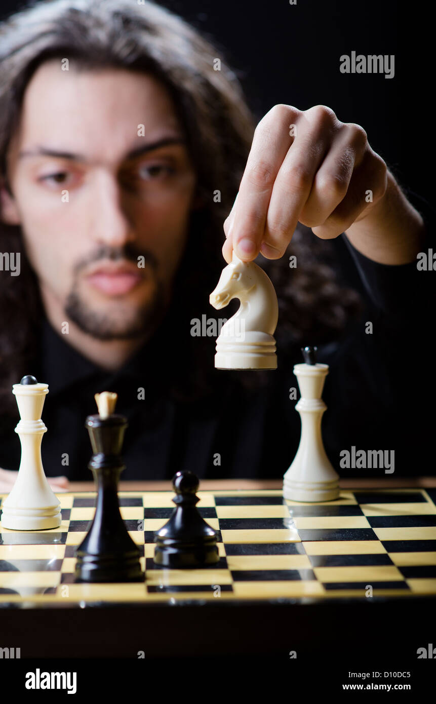 Chess player playing his game Stock Photo - Alamy