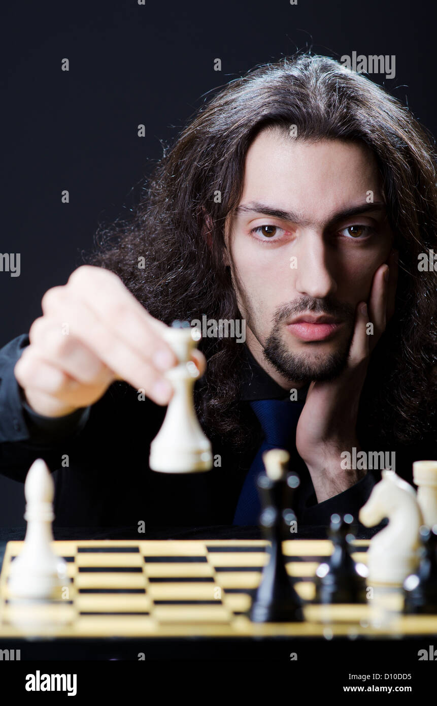 Chess player playing his game Stock Photo - Alamy