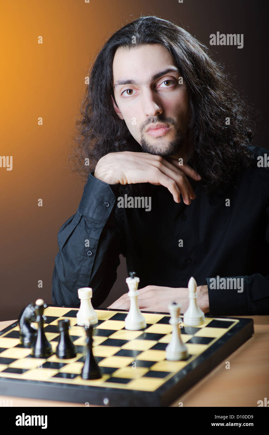 Chess player playing his game Stock Photo - Alamy