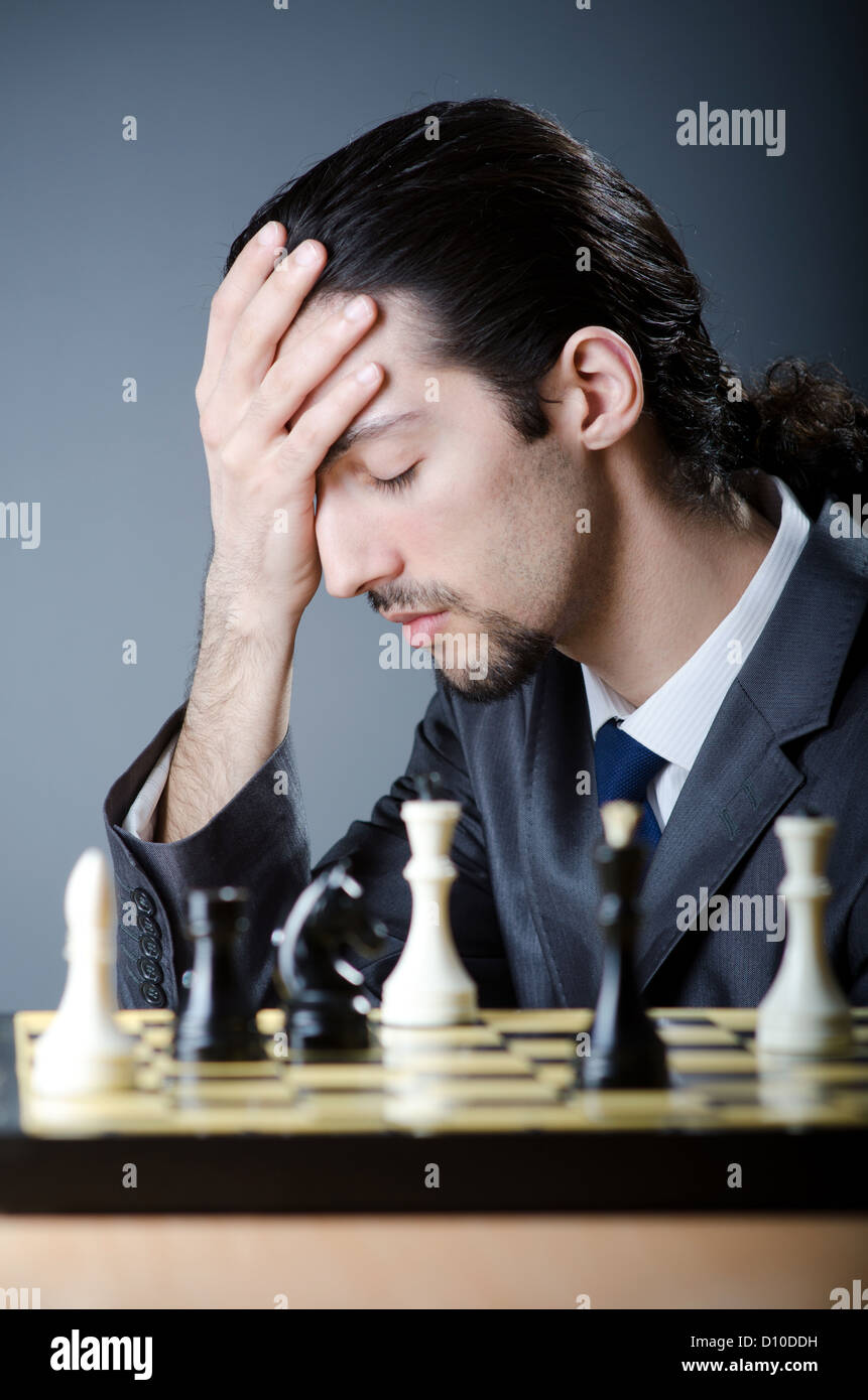 Chess player playing his game Stock Photo - Alamy