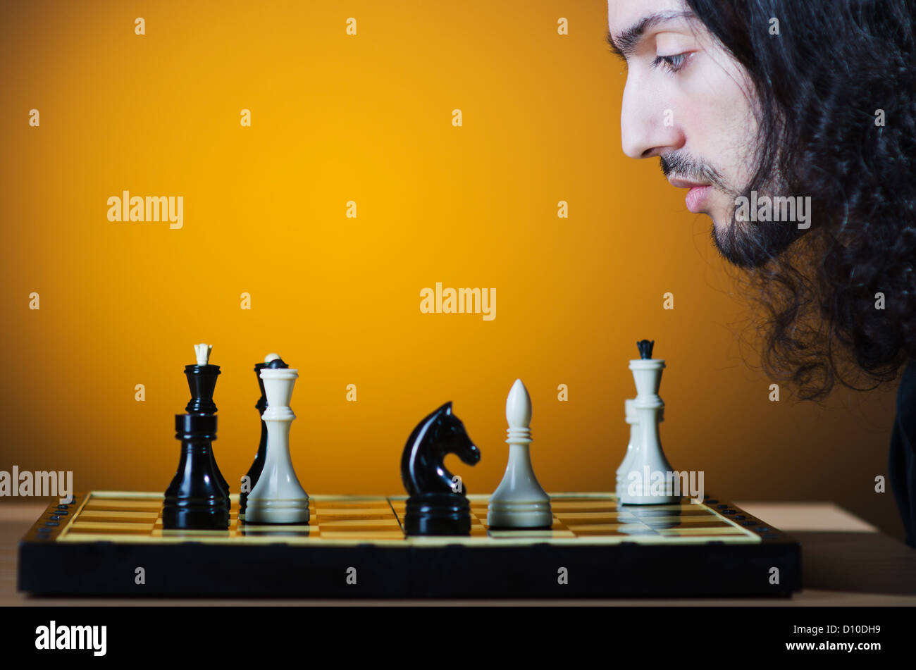 Chess player playing his game Stock Photo - Alamy