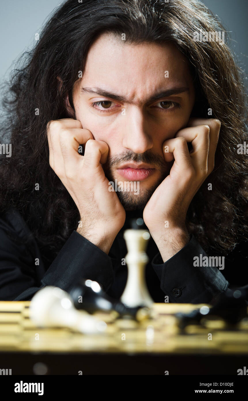 Chess player playing his game Stock Photo - Alamy