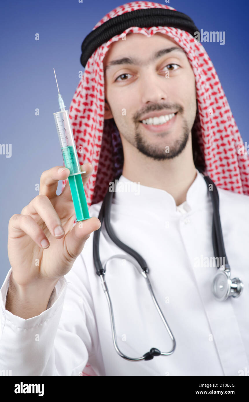 Arab doctor with syringe Stock Photo - Alamy