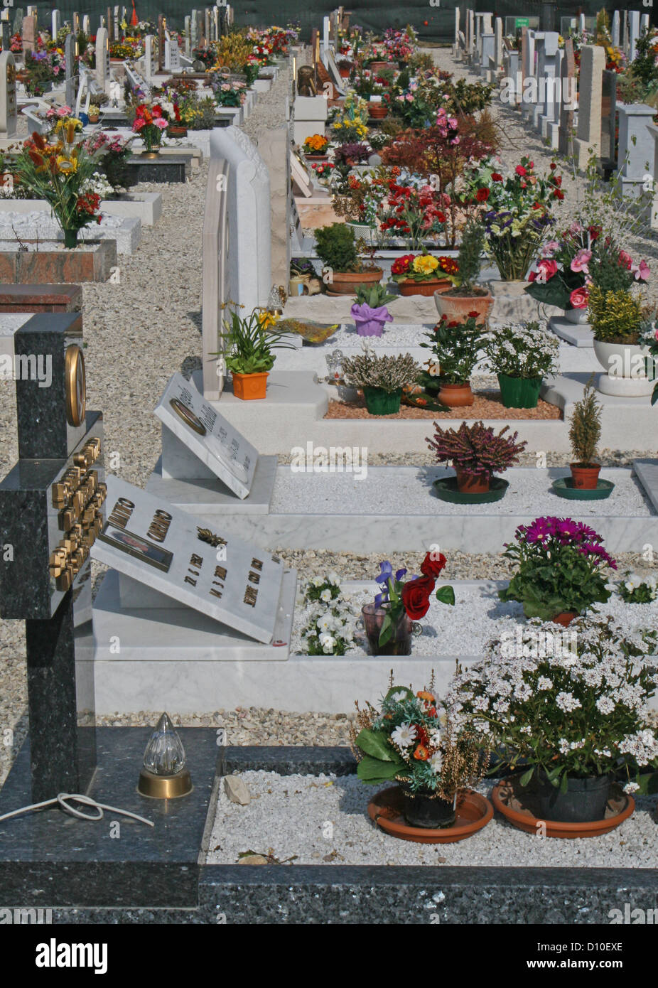 graves headstones and crucifixes of a cemetery outdoor in Italy Stock ...
