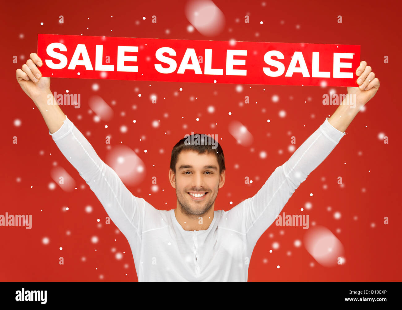 handsome man with sale sign Stock Photo - Alamy