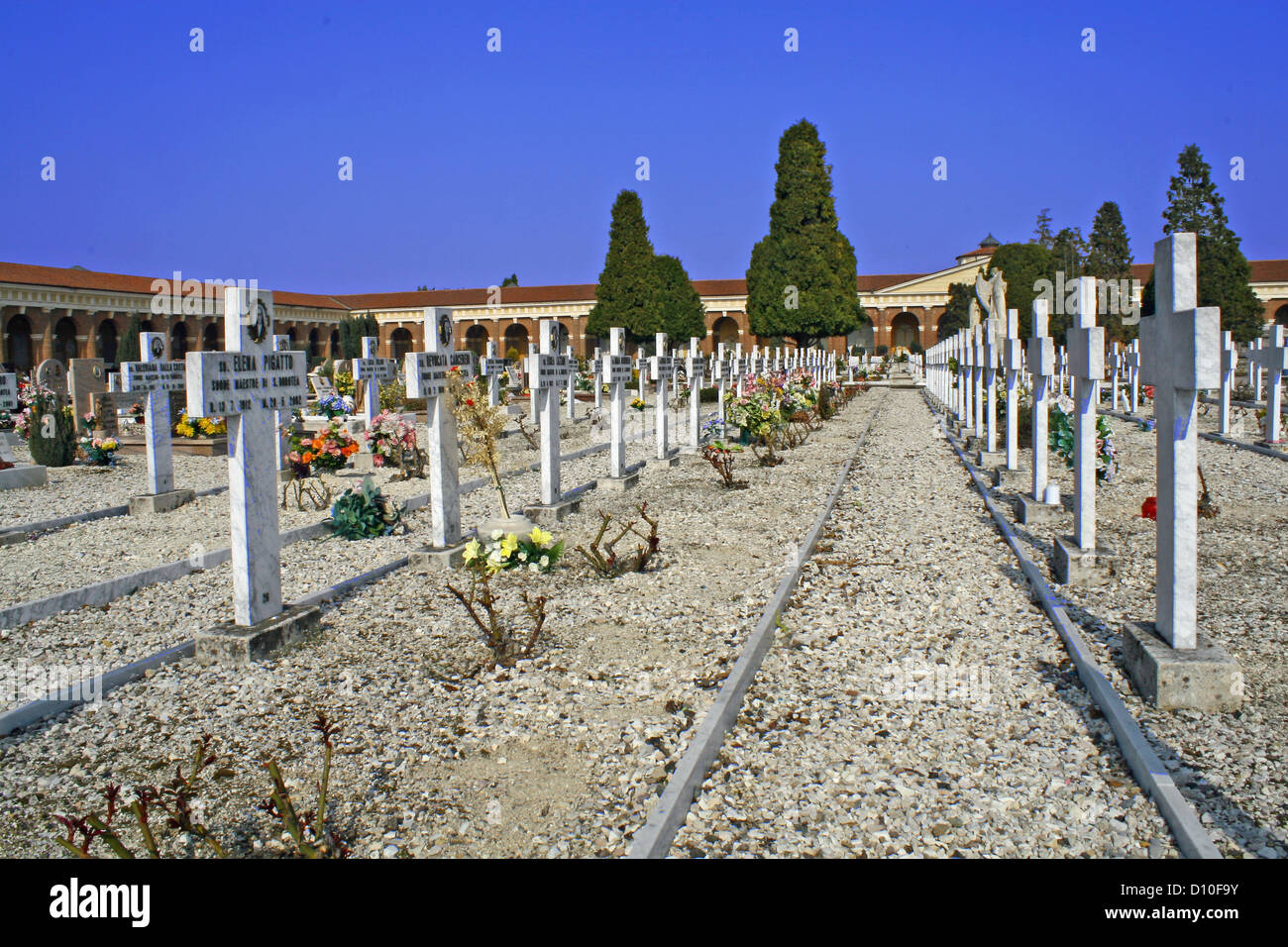 graves headstones and crucifixes of a cemetery in Italy Stock Photo - Alamy