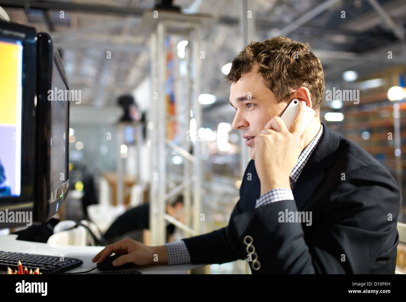 Working and talking on the phone Stock Photo - Alamy