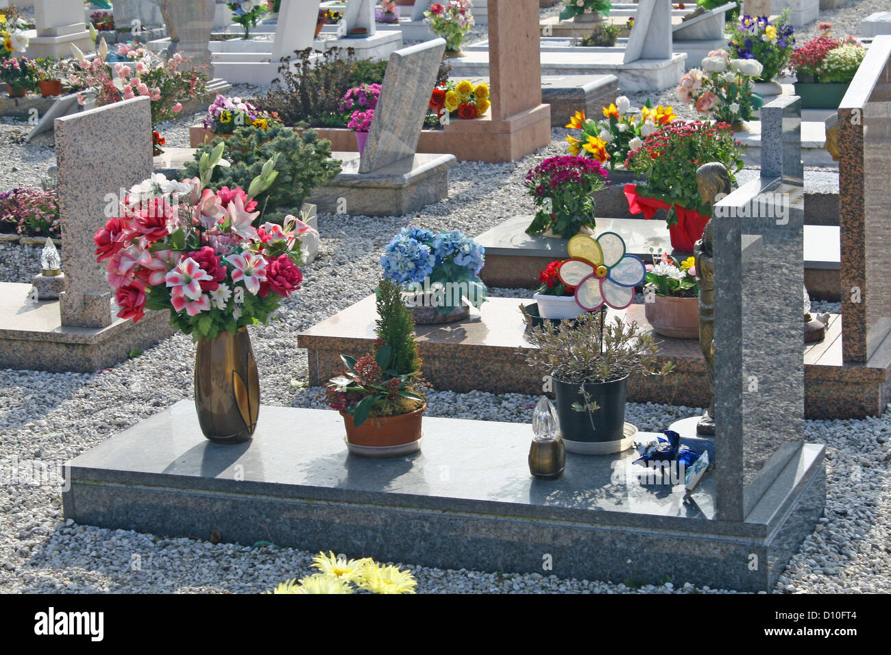 graves headstones and crucifixes of a cemetery in Italy Stock Photo - Alamy