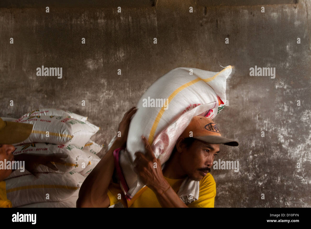 Loading rice sacks hi-res stock photography and images - Alamy