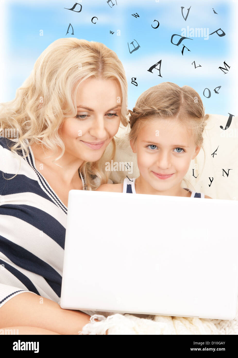 happy mother and child with laptop computer Stock Photo - Alamy