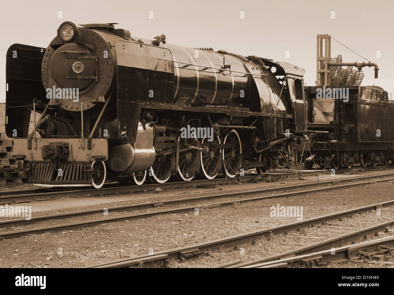Old vintage steam train on tracks in shunting yard Stock Photo - Alamy
