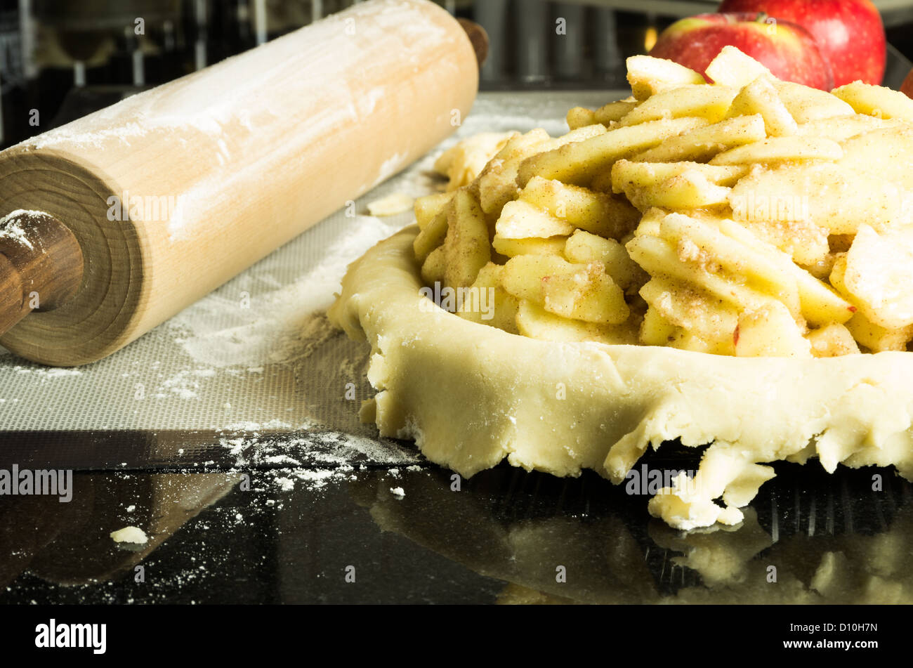 Apple pie with apples filling and rolling pin Stock Photo - Alamy
