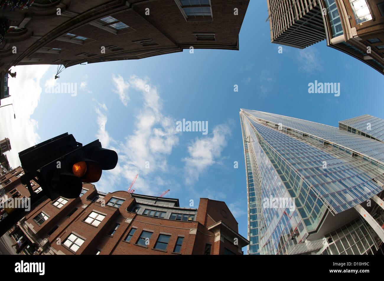 The Shard, a 95-storey skyscraper surrounded by other buildings in ...