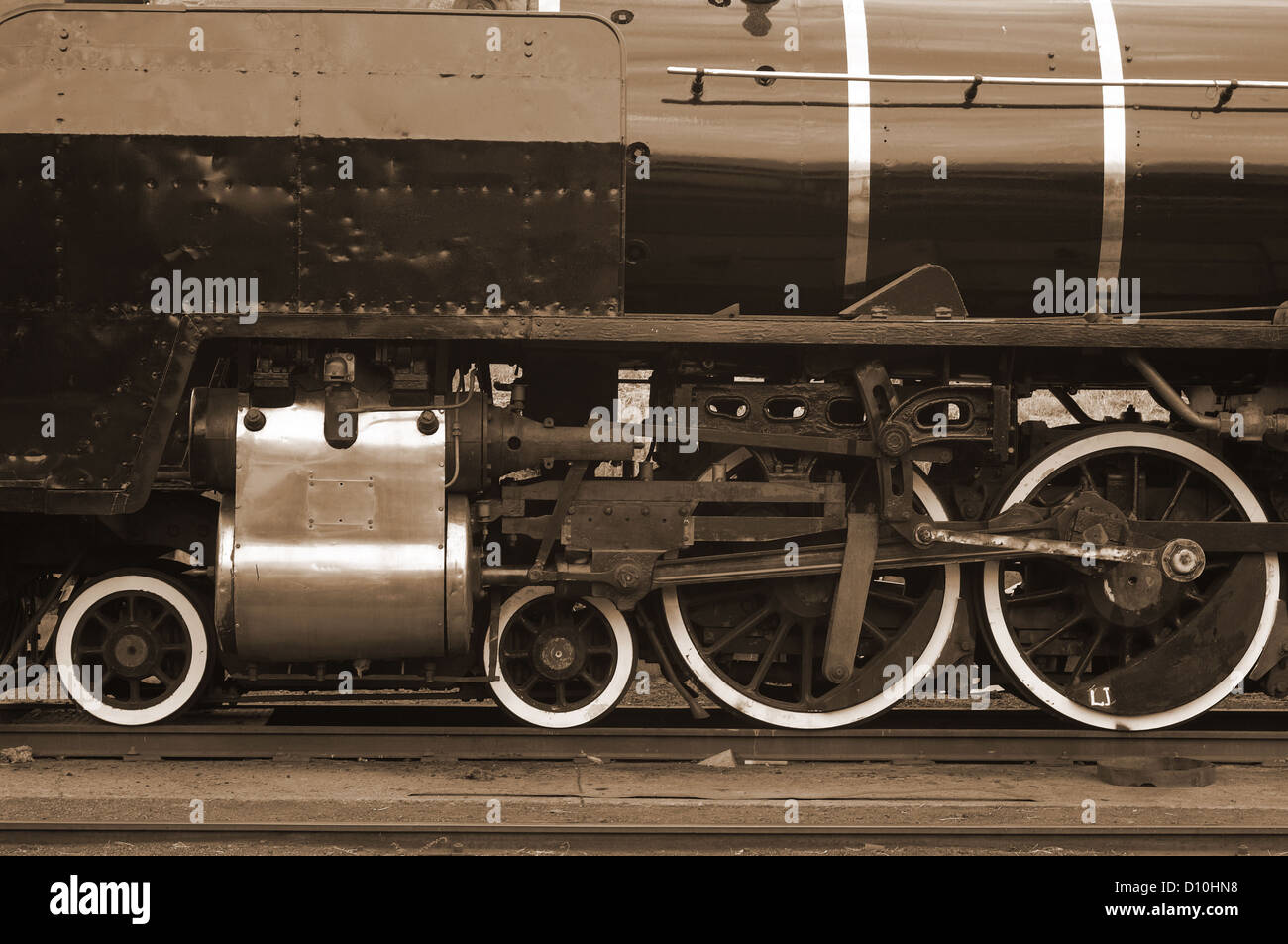 Steam train locomotive moving parts, gears and wheels in sepia Stock ...