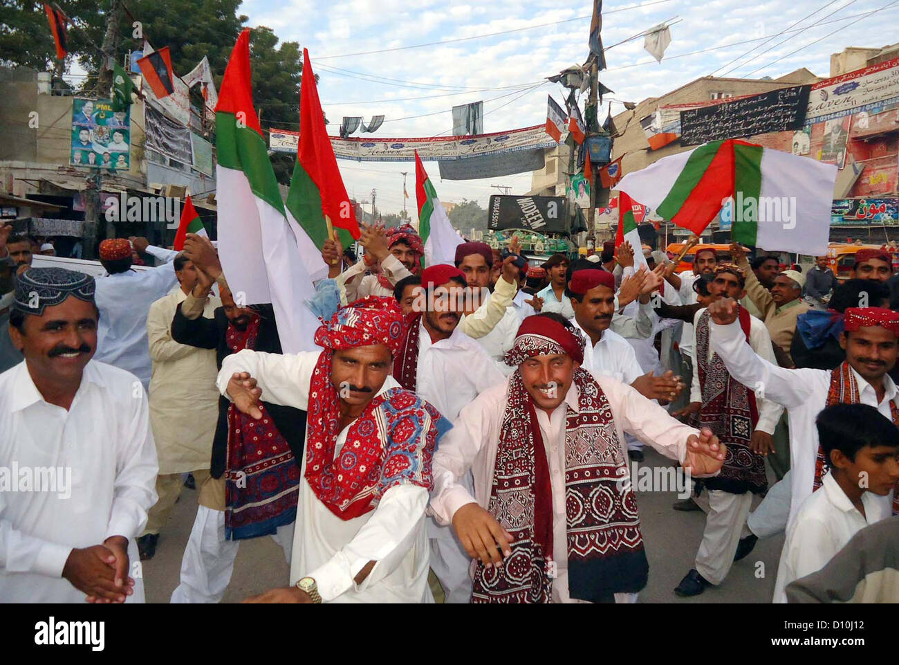 Activists of Muttehda Qaumi Movement dance on traditional tunes during ...