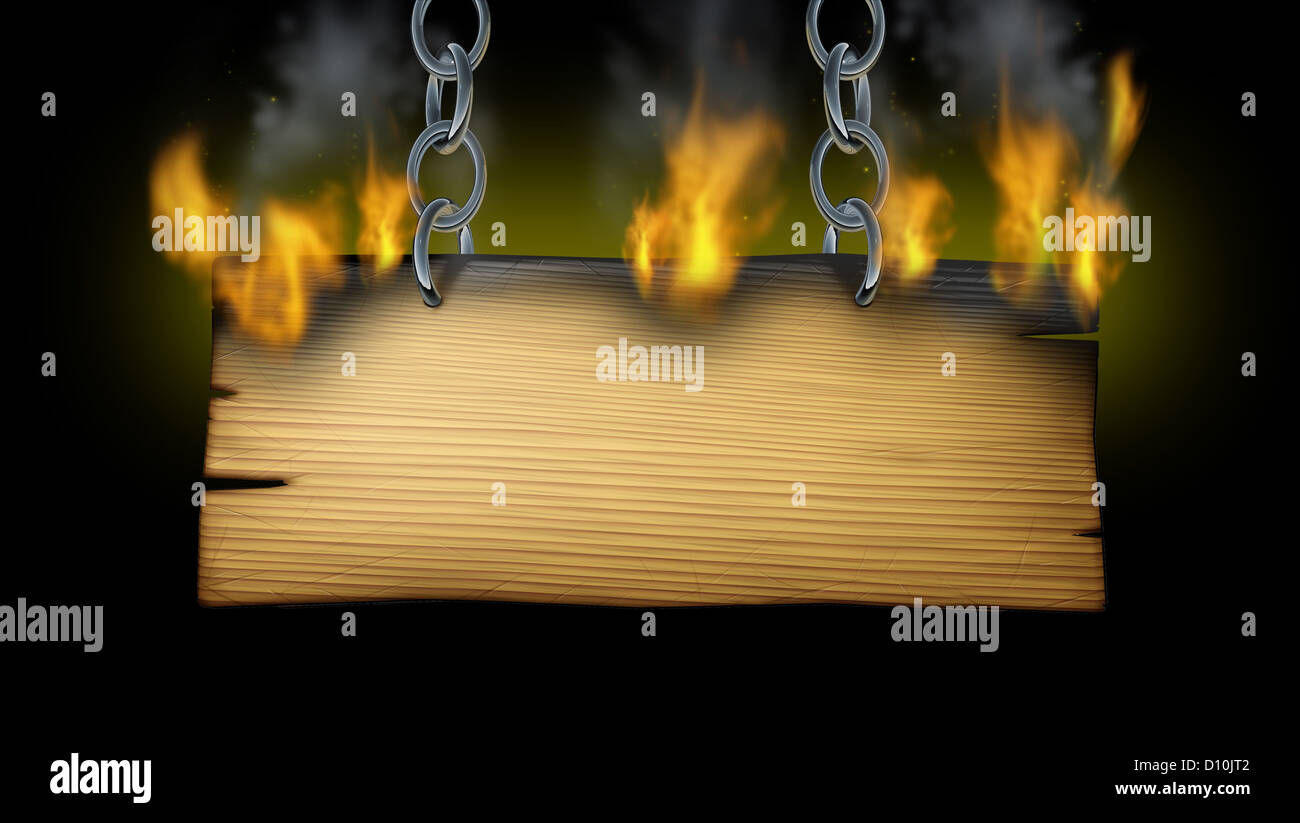 Burning wooden sign with fire flames and smoke on an old wood plank ...
