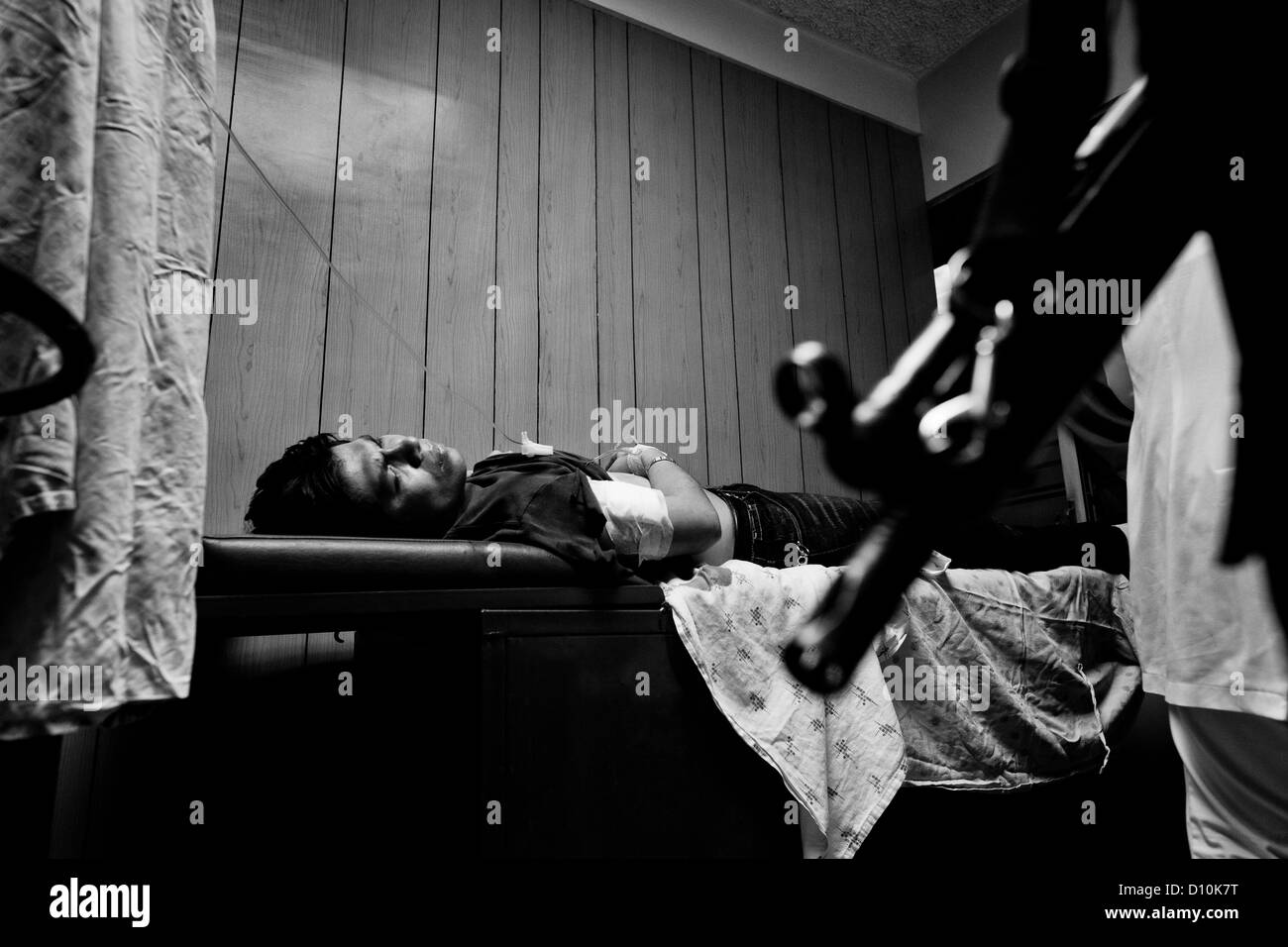 A young man fights for his life after being stabbed in the chest with a ...